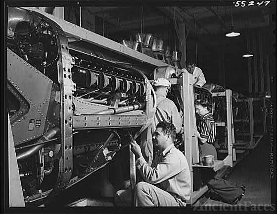 North American employees assemble the cowling on Allison...