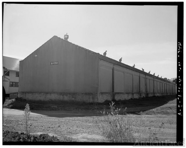 Oblique view of west side, showing loading ramp, 1995