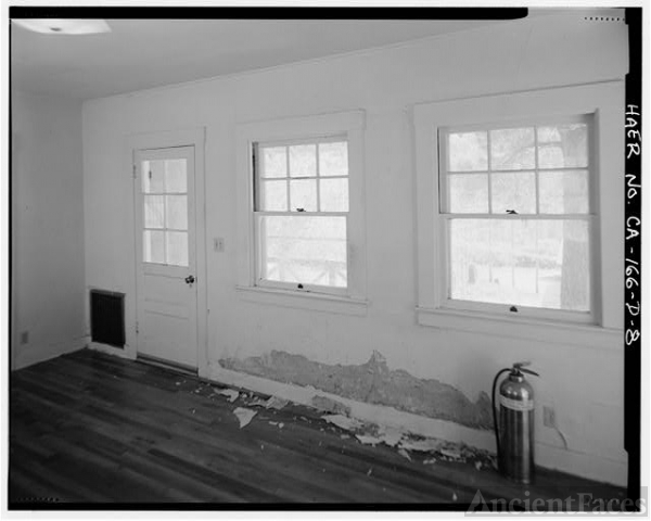 8. INTERIOR OF LIVING ROOM SHOWING 6-LIGHT FRONT ENTRY...