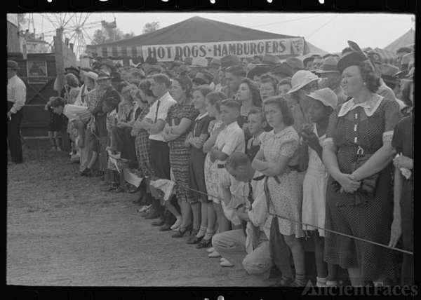 Crowd of people behind the rope watching ceremonies on...