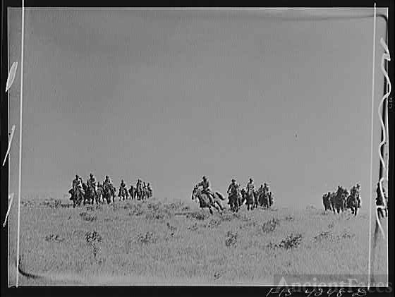 Fort Riley, Kansas. Cavalry unit charging during a sham...