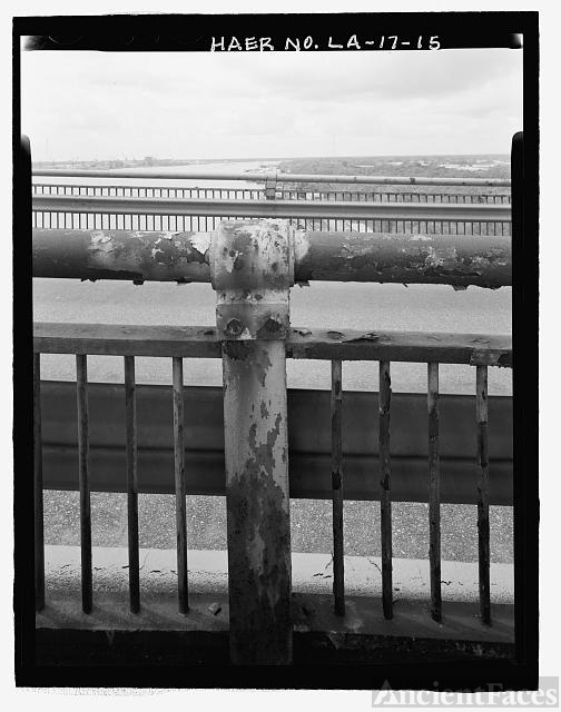 CLOSE-UP VIEW OF ELEVATED HIGHWAY RAILING LOOKING...