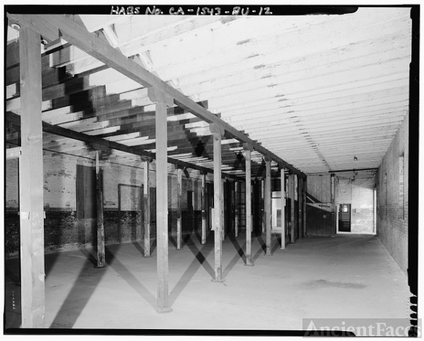 Interior view of first floor showing structural support;...