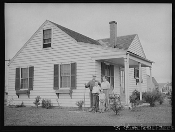 The Bollinger family in front of their home. Decatur...