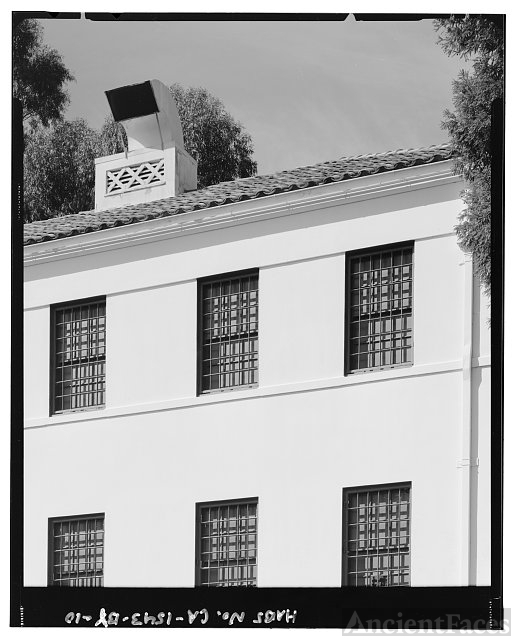 Detail of second floor windows and chimney on southeast...