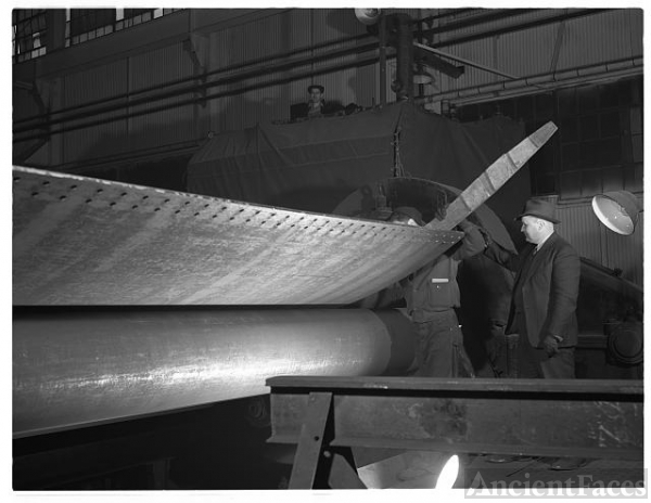 Shipbuilding. "Liberty" ships. This giant plate roller,...