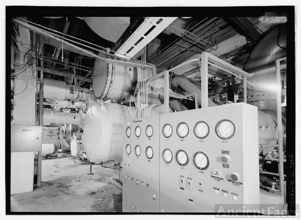 STEAM TURBINE RIGHT BACKGROUND POWERING COMPRESSOR JUST...