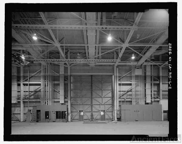 INTERIOR VIEW OF EAST SIDE WALL AND DOOR, FACING EAST.