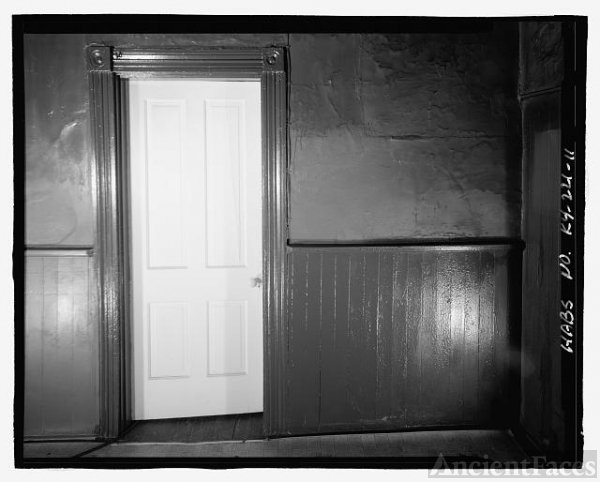 11. View of east wall of rear room (labeled kitchen in...