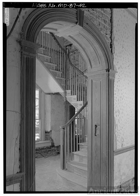 CENTRAL HALL: VIEW TO ENTRY HALL THROUGH ARCH TO...