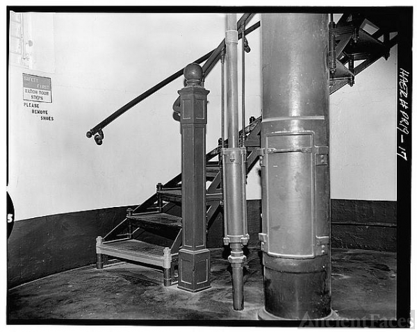 17. DETAIL VIEW OF BASE OF STAIRS, WITH CLOCK WORKS...