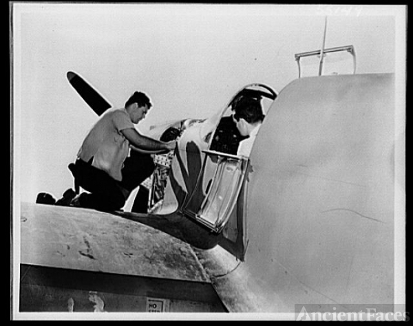 A North American P-51 fighter is given final inspection...