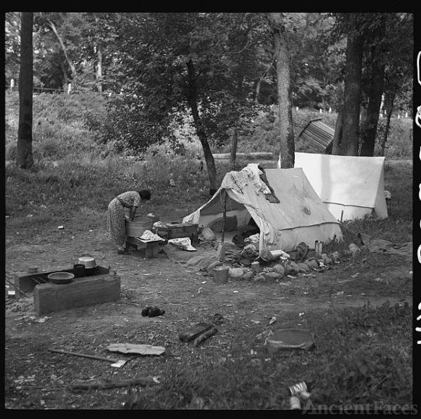 Indian woman washing clothes. Blueberry camp, Littlefork,...