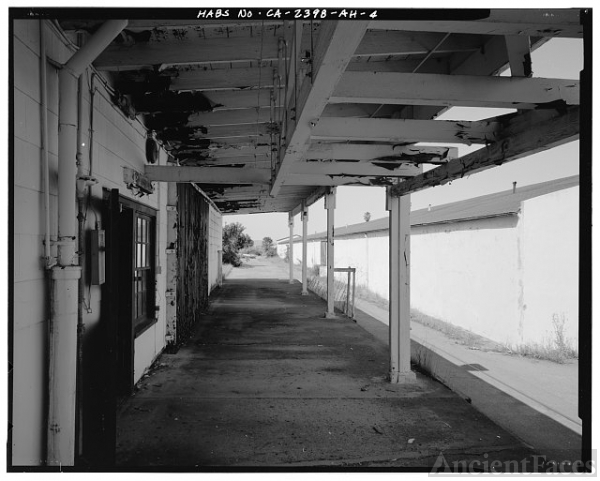 VIEW TO NORTHEAST ALONG LOADING DOCK TO RAIL SPUR, AND...