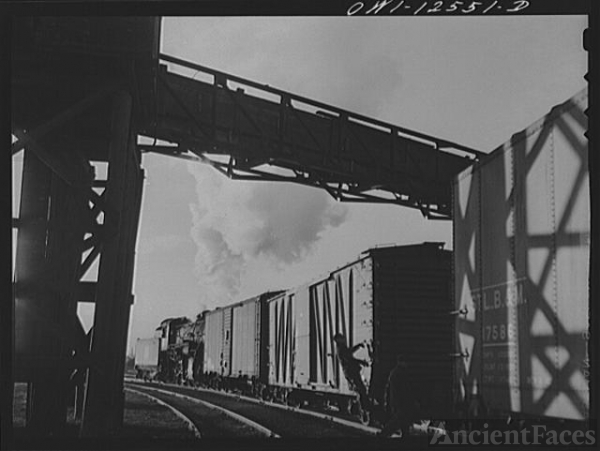 Chicago, Illinois. Switchman riding a car in a flat...