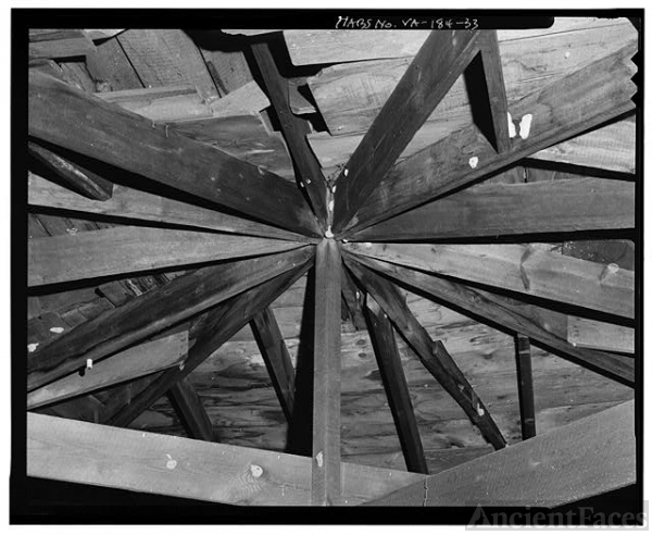 33. KING POST AT CENTER OF ROOF STRUCTURE IN ATTIC