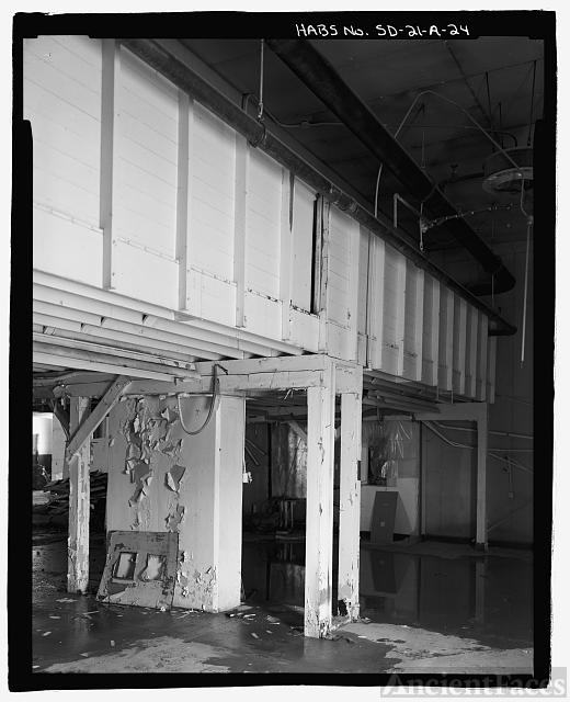24. Machine shop showing base of concrete buttress. View...