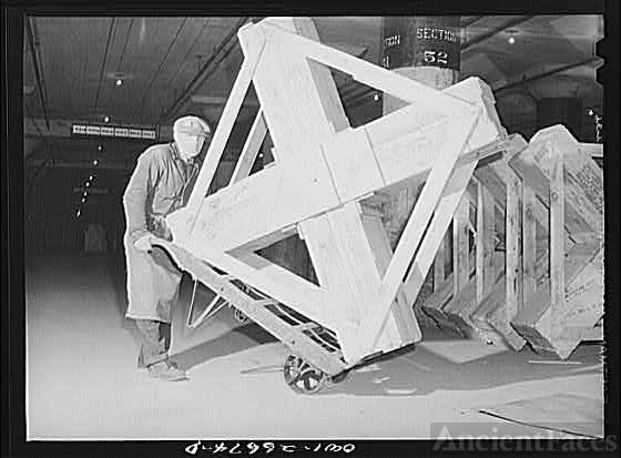 Chicago, Illinois. Loading airplane propeller into...