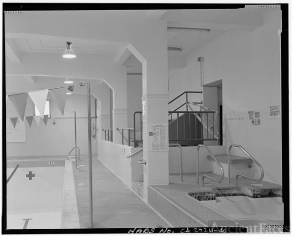 Swimming pool. View of aisle between swimming pool and...