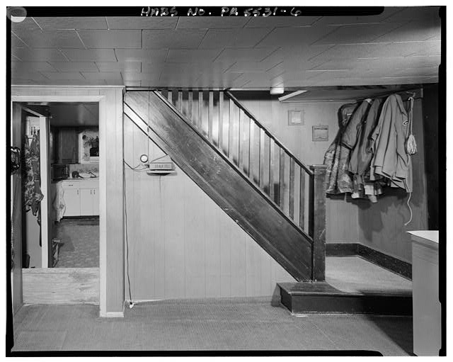 6. FIRST FLOOR, VIEW NORTH, MAIN ROOM AND STAIRS