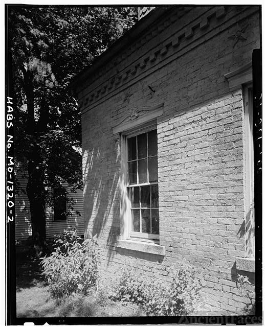 2. DETAIL OF CAST-IRON WINDOW LINTEL AND BRICK CORNICE