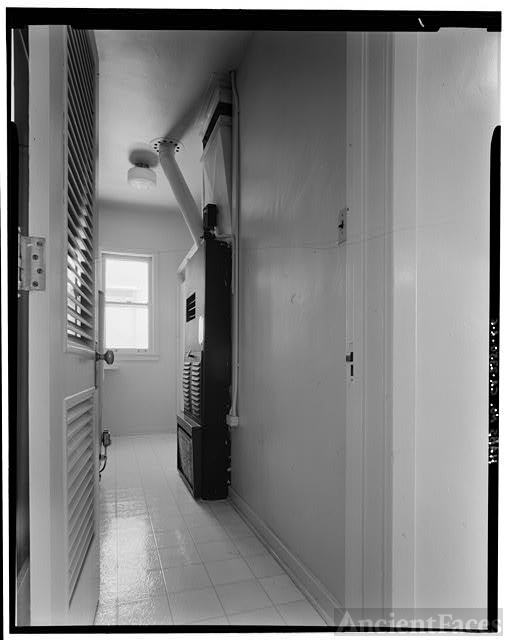 6. HEALTH CENTER OFFICE UTILITY ROOM, FRONT OF FURNACE.