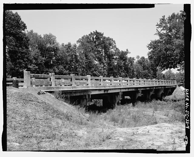 4. OBLIQUE VIEW OF SOUTH SIDE OF WESTERN END OF BRIDGE...