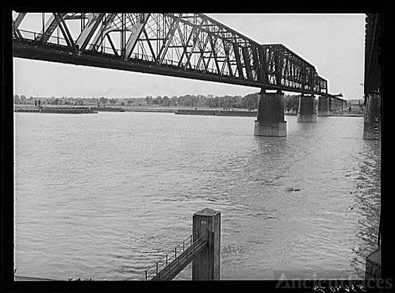 River gauge for water level and bridge across the...
