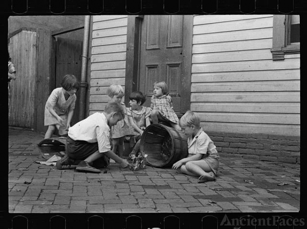 Poor children playing on sidewalk, Georgetown,...