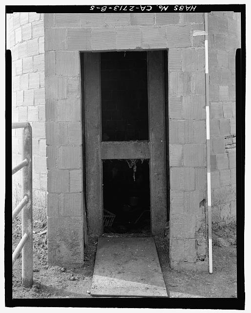 Detail (with visual scale) of silo's ground level entry;...