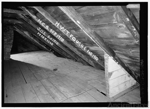 Detail of graffiti on rafters in attic south room