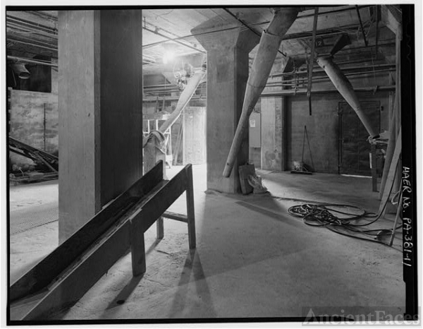 1945 elevator basement indicating grain spouts, looking...