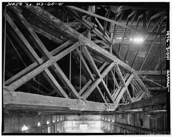 41. DETAIL VIEW OF TRIPLED, HEAVY TIMBER TRUSSES IN...