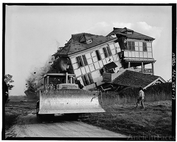 19. DURING DEMOLITION, SHOWING HOUSE SPLITTING IN HALF...