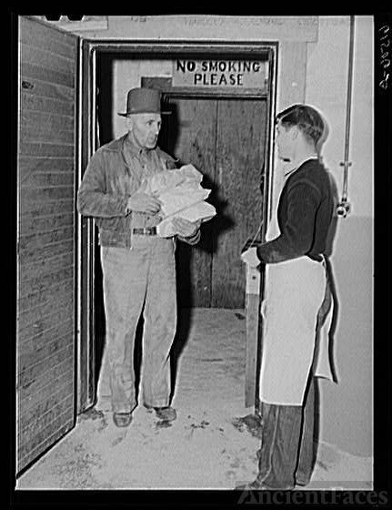 Farmer coming out of cold storage lockers with meat to...