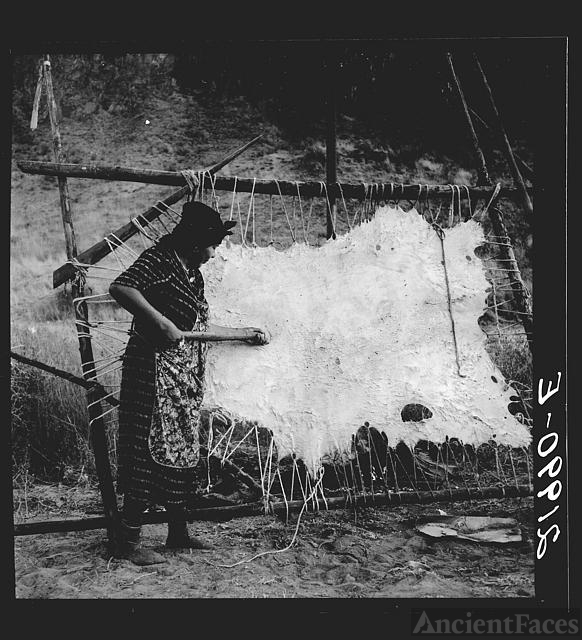 Method of scraping hide for softening. Indian fishing...