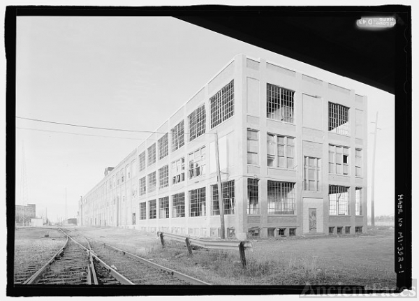 WEST FACADE. THREE-STORY BRICK AND STEEL BUILDING WITH...