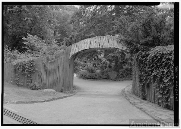 15. VIEW OF THE RECONSTRUCTED ENTRY ARCH AND SPRUCE POLE...