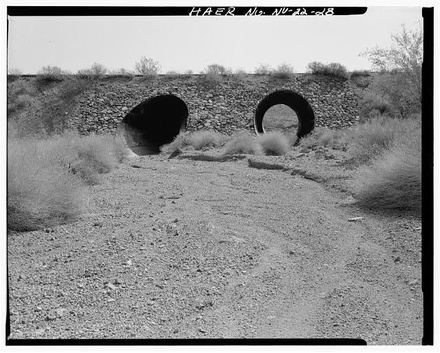 Upstream headwall, riprap, double culverts, facing east....