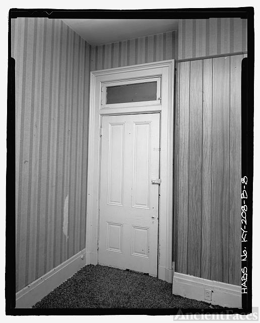 8. Typical panel door, transom and wooden door surround,...