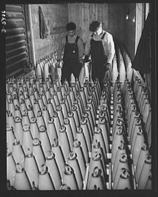 Production. 155mm shells. Loading 155mm shell bodies for...