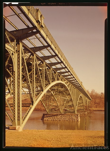 OBLIQUE VIEW OF FOUR WROUGHT IRON ARCHES WITH...