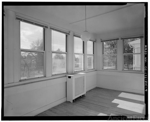 Enclosed porch (second floor, south side of building