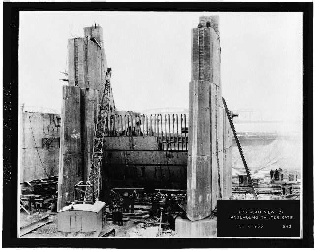 52. UPSTREAM VIEW SHOWING THE ASSEMBLING OF TAINTER GATE...