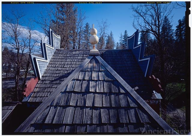 View of center pyramidal roof and rear gable roof