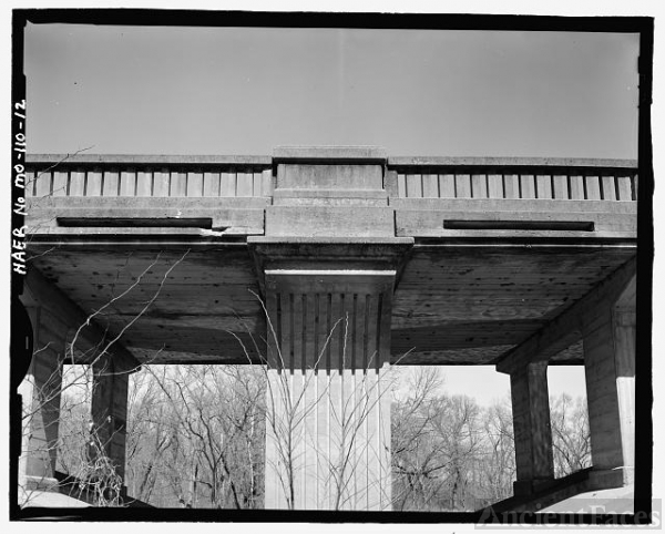 CLOSE-UP VIEW OF FLUTED PIER COLUMN, FLARED CROWN, AND...