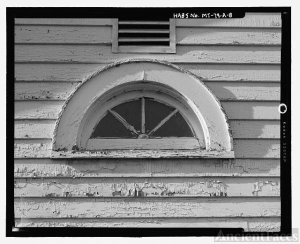 Detail of half-circular window in gable end of east side....
