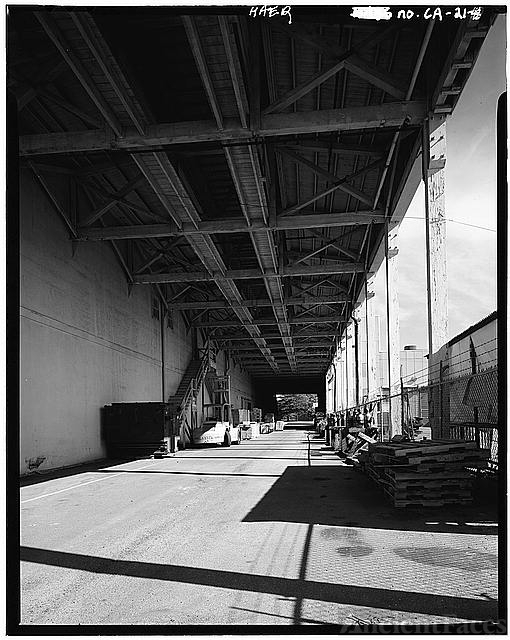 4. RAILROAD LOADING AREA; WEST SIDE OF BUILDING, LOOKING...