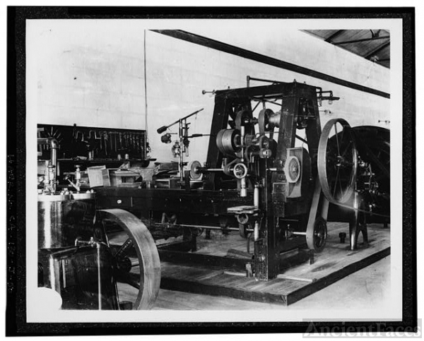 50. BELT-DRIVEN LATHE AND WORK BENCH, SHOWING TOOL...