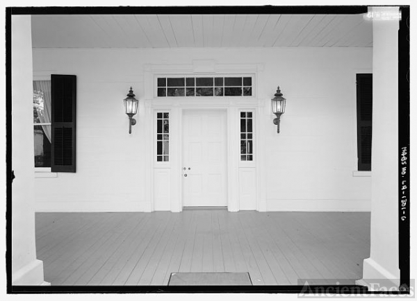 6. Detail view of the east elevation, front door